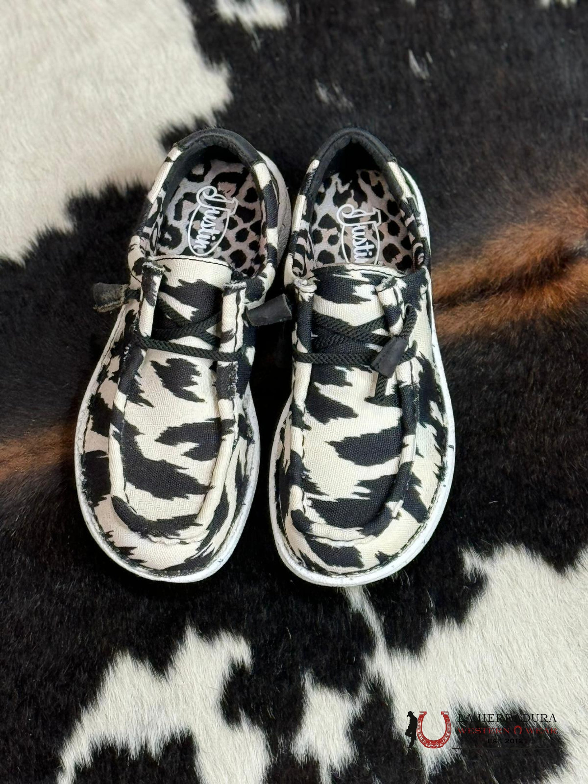 JUSTIN LEATHER AND FABRIC UPPER BALANCE COW PRINT